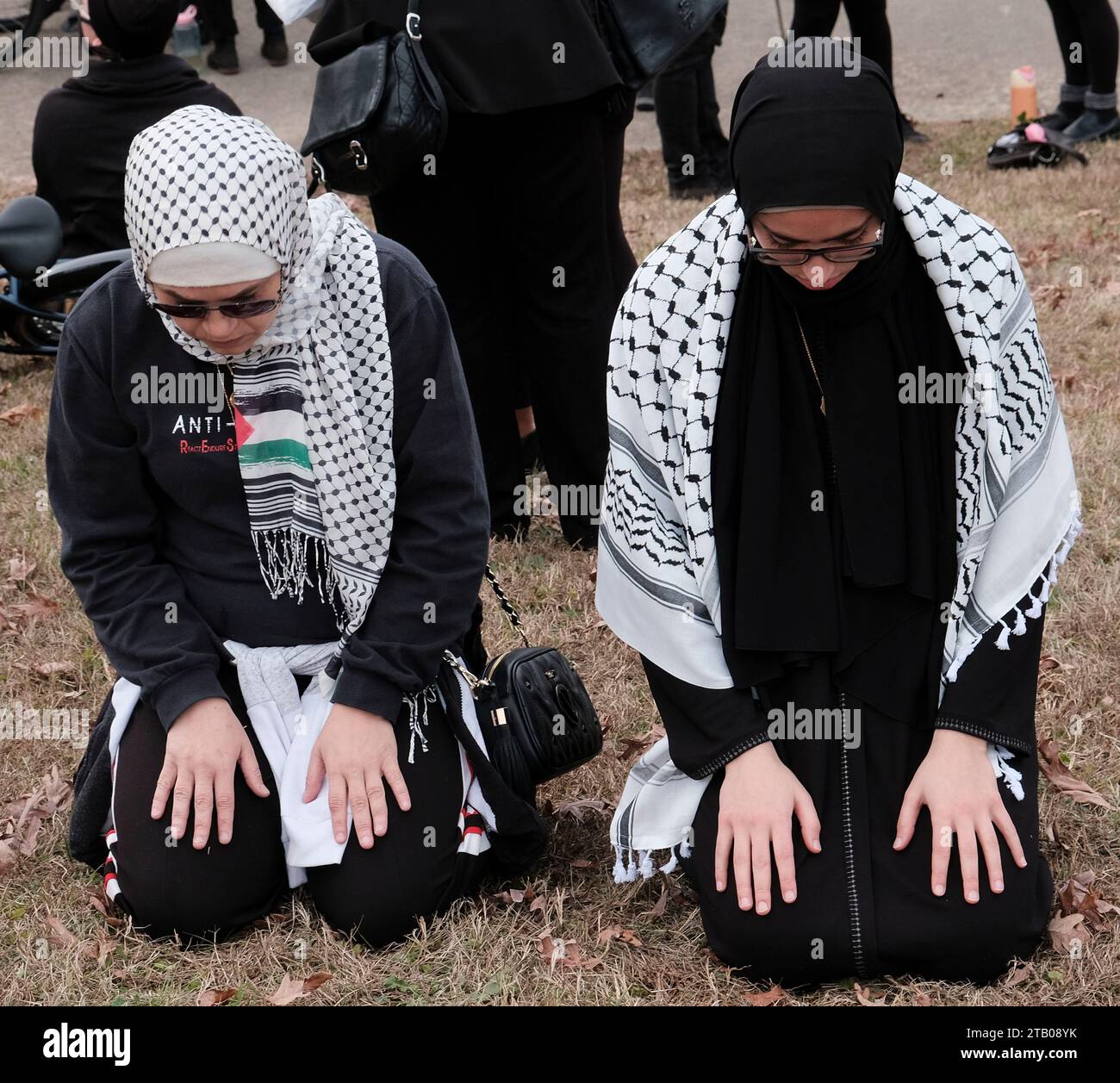 Atlanta, Georgia, USA. 3rd Dec, 2023. Two Muslim women engage in prayer ...