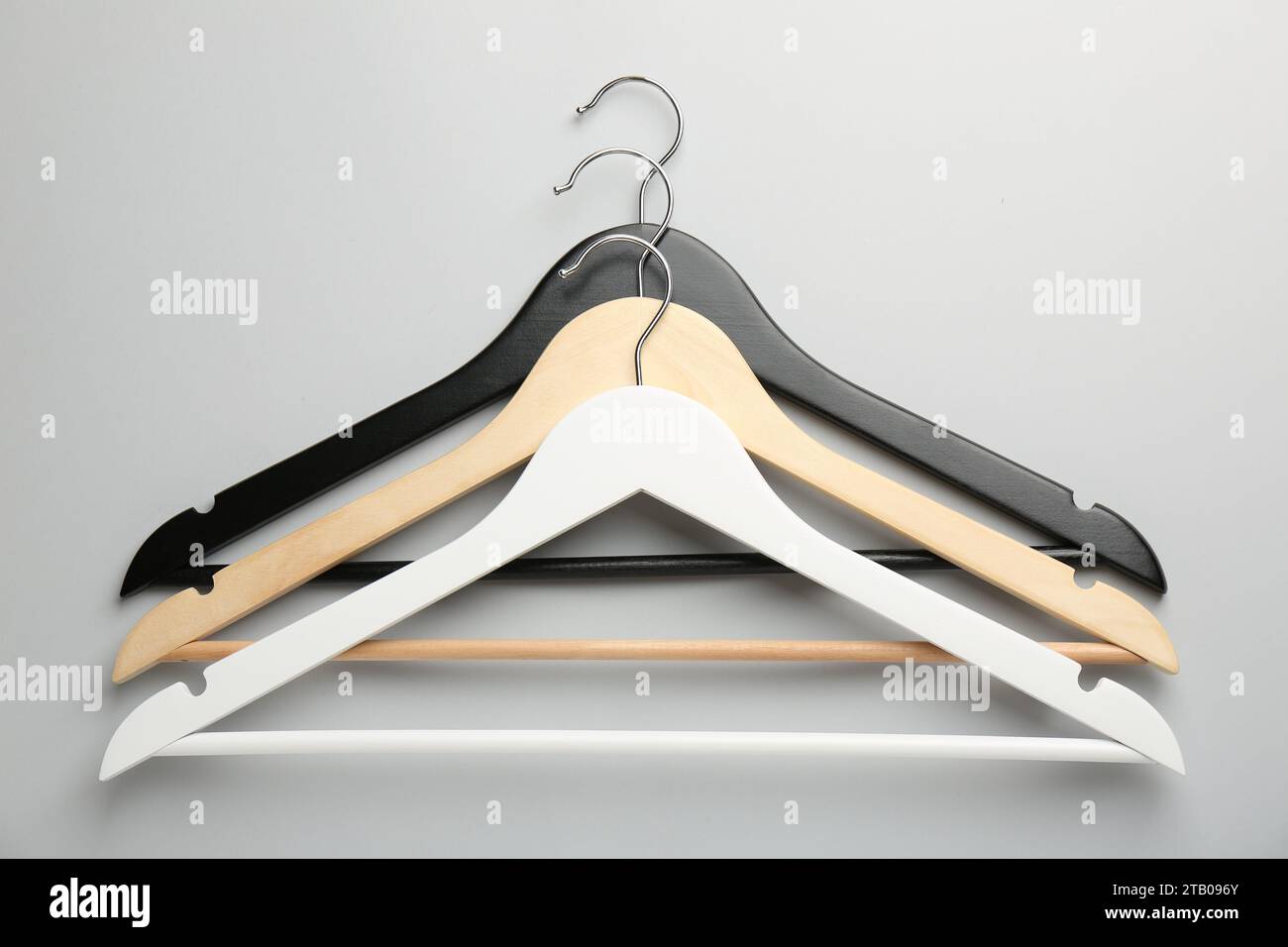 Different hangers on light gray background, top view Stock Photo - Alamy