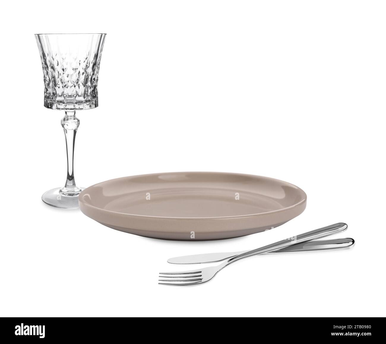 Clean plate, cutlery and glass on white background Stock Photo - Alamy