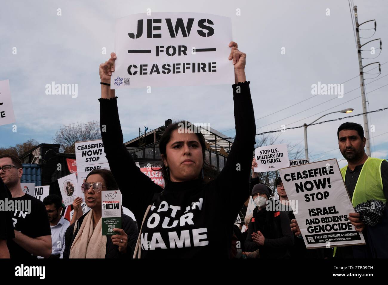 Atlanta, Georgia, USA. 3rd Dec, 2023. a group of protesters, one ...