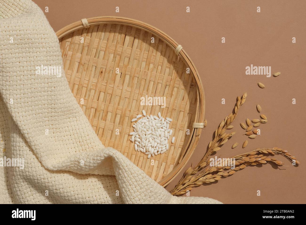 Flat winnowing basket, white rice, whole grain rice and beige fabric ...