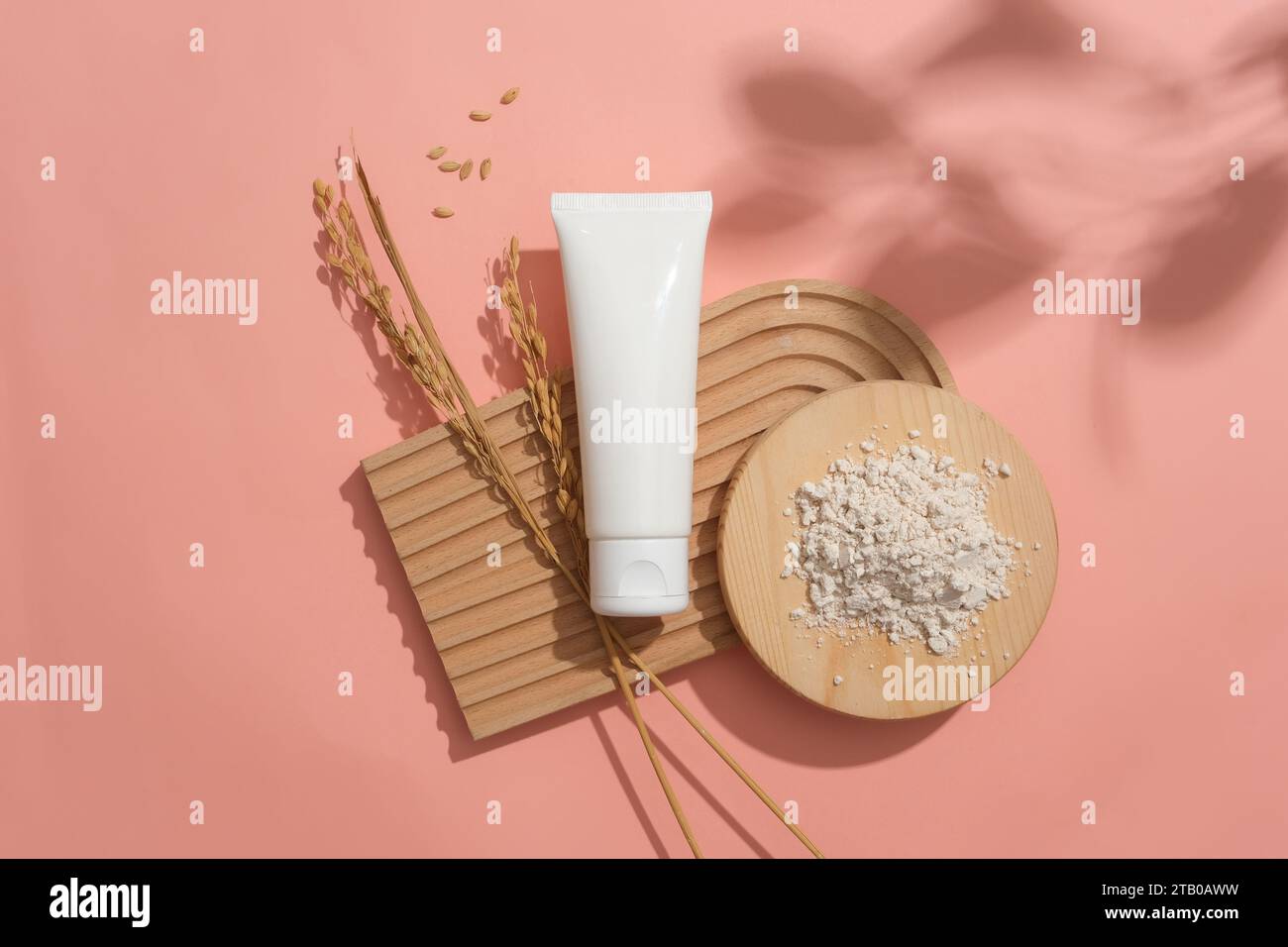 Rice bran powder is displayed on a round wooden podium. An unlabeled ...