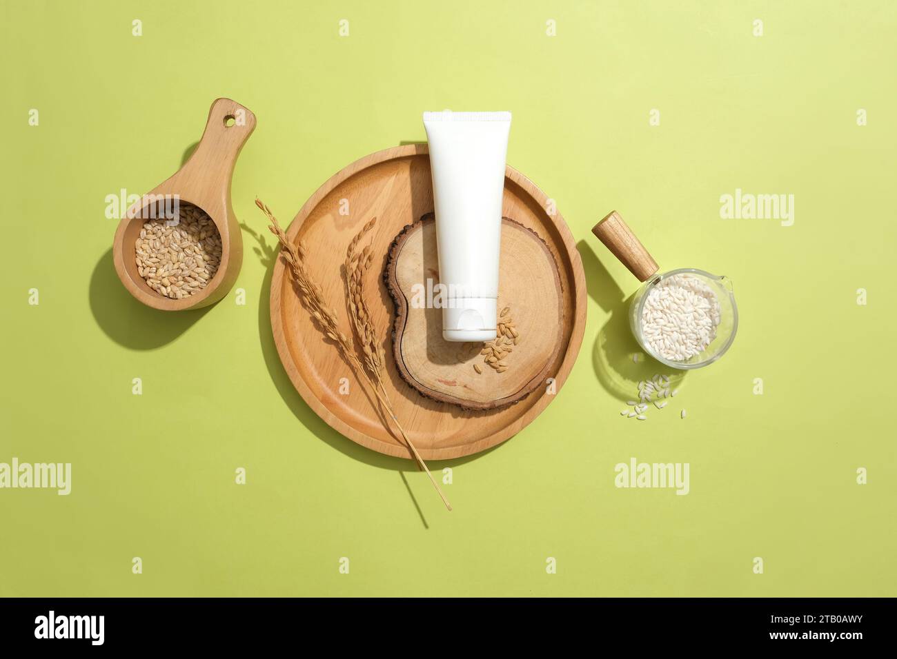 A cosmetic tube with rice bran extract stands out on a pastel ...