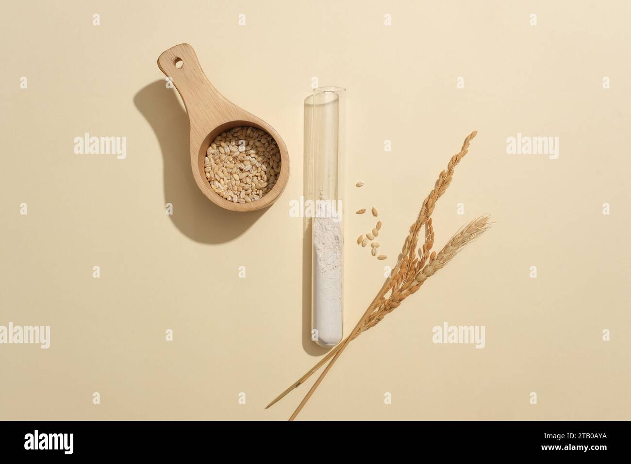 Whole rice is stored in a small wooden bowl, rice flour is contained in ...