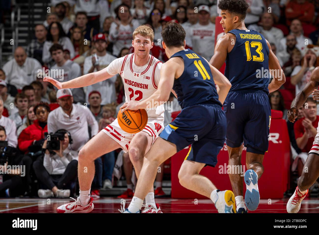 Wisconsin Badgers center Steven Crowl (22) defends against Marquette ...
