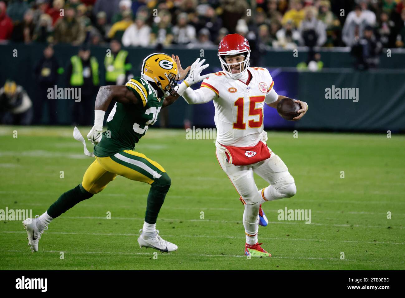 Kansas City Chiefs quarterback Patrick Mahomes (15) stiff arms Green ...