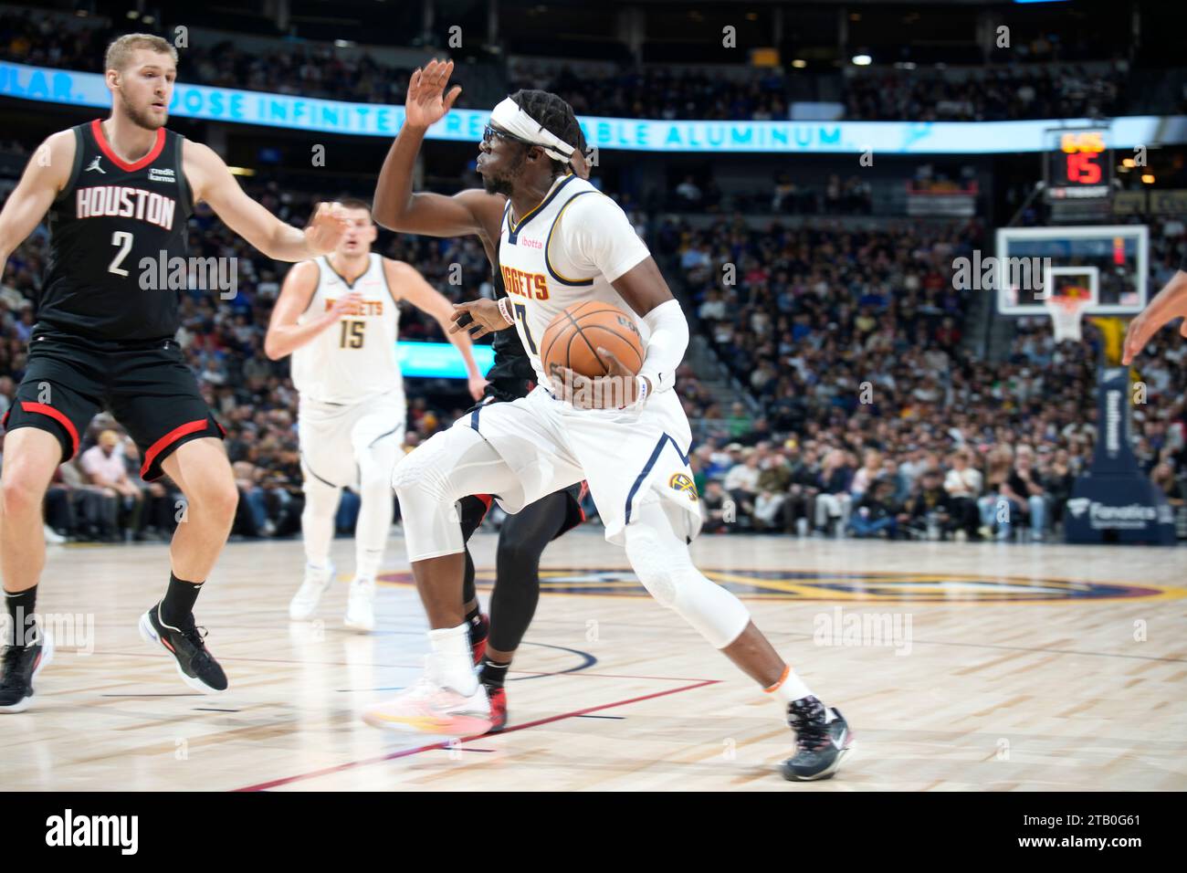 Denver Nuggets guard Reggie Jackson (7) drives to the rim as Houston ...
