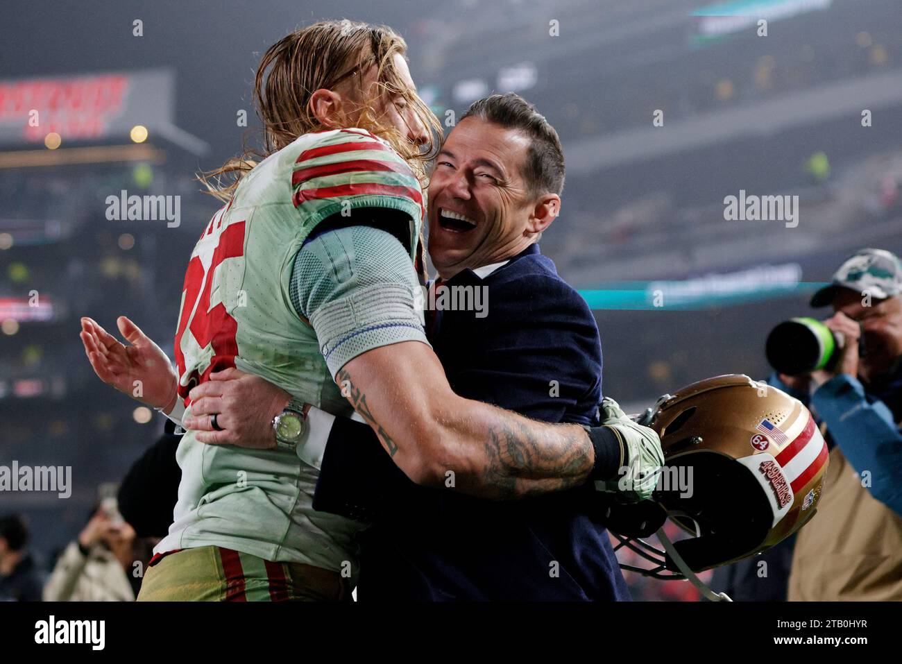 San Francisco 49ers tight end George Kittle (85) hugs team president Al ...