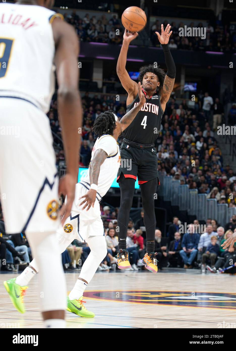 Houston Rockets guard Jalen Green (4) shoots over Denver Nuggets guard ...