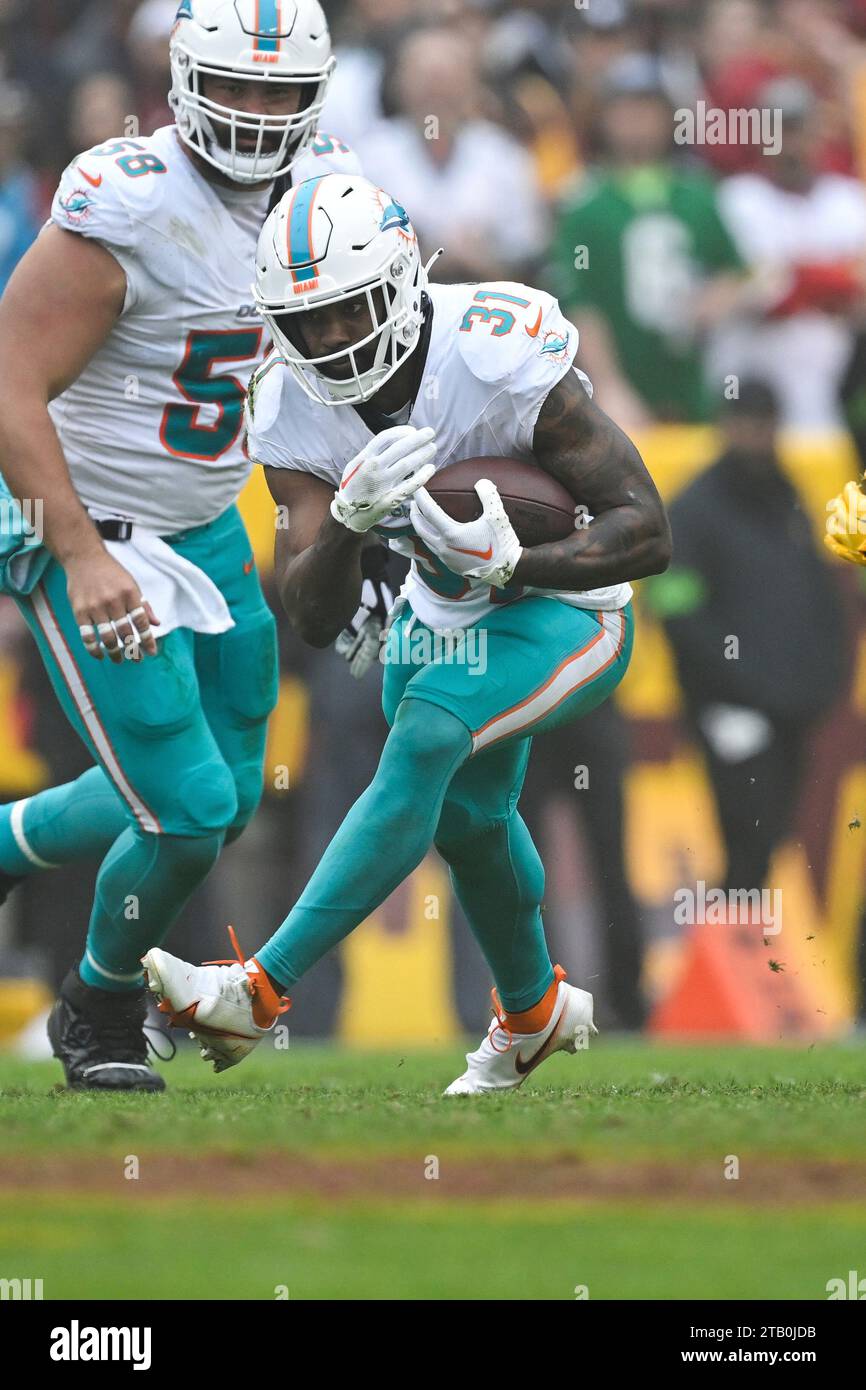 Miami Dolphins running back Raheem Mostert (31) runs the ball during the first half of an NFL ...