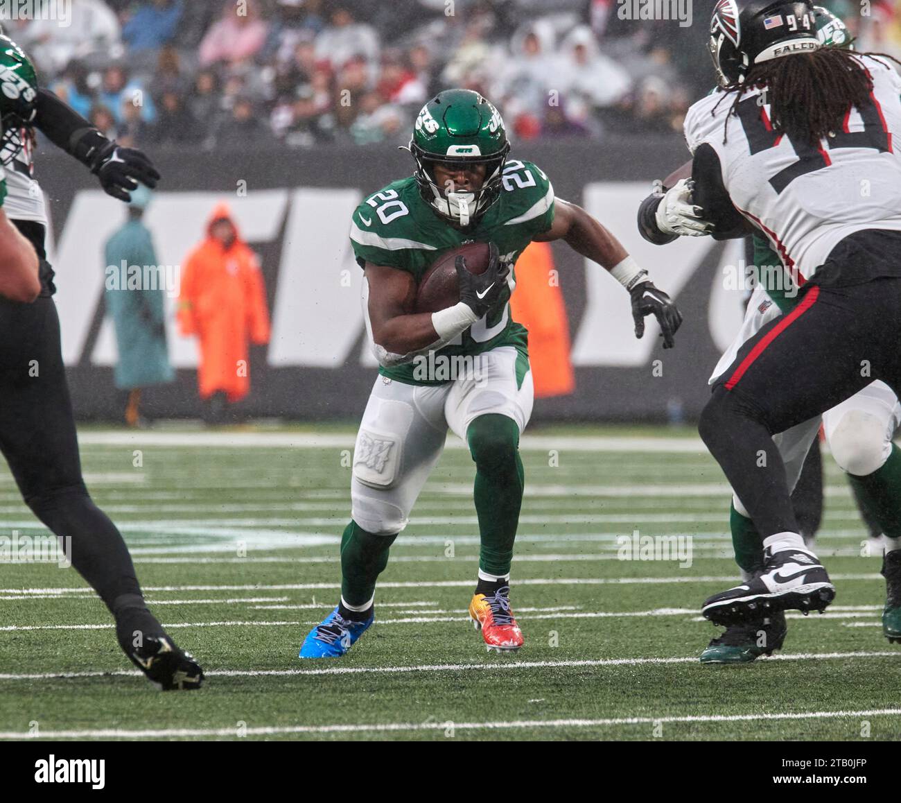 New York Jets running back Breece Hall (20) looks for running room ...
