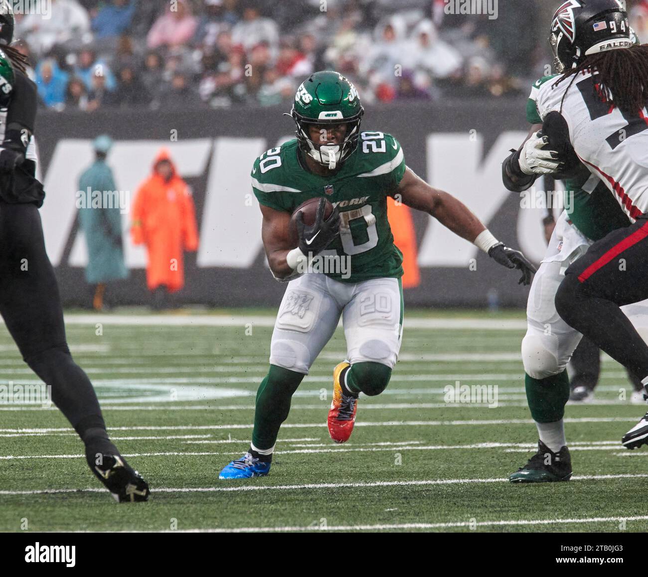 New York Jets running back Breece Hall (20) looks for running room ...