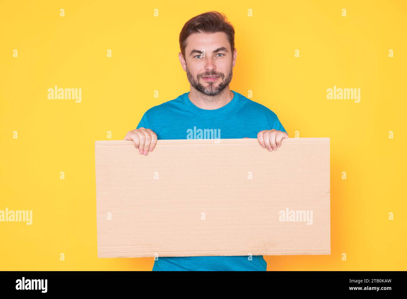 Man with empty blank board on studio background. Blank board signboard ...