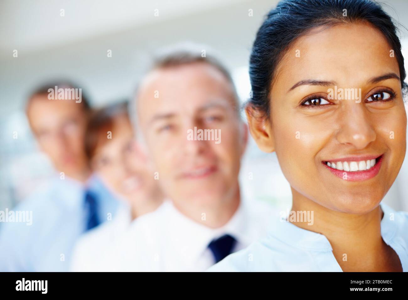 Smile, portrait of business woman with team in the office for positive ...