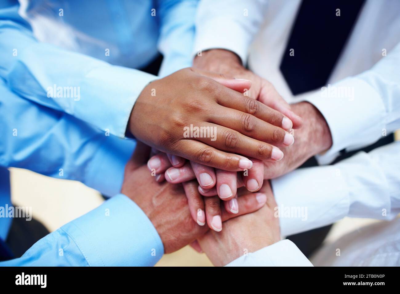 Business people, hands together and teamwork for motivation, unity or collaboration at office ...