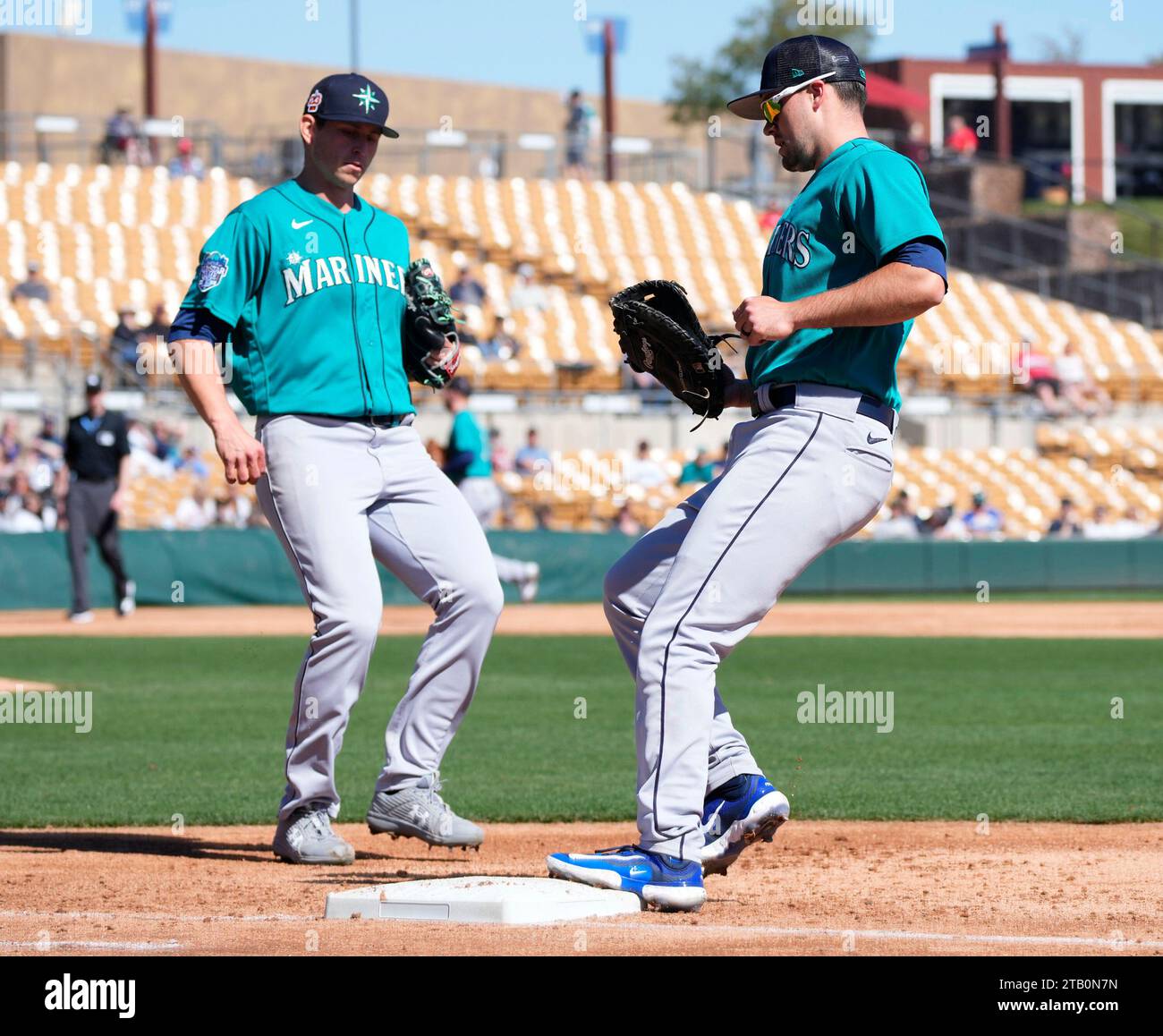 FILE - Seattle Mariners first baseman Evan White, right, beats Mariners ...