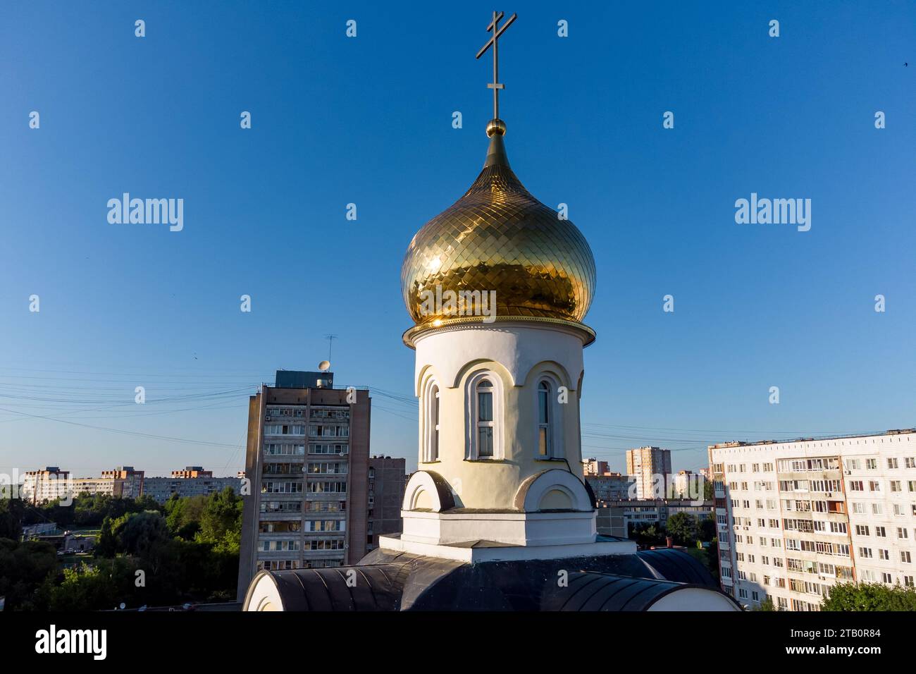 Gilded dome with a cross of the Russian Orthodox Church against the ...