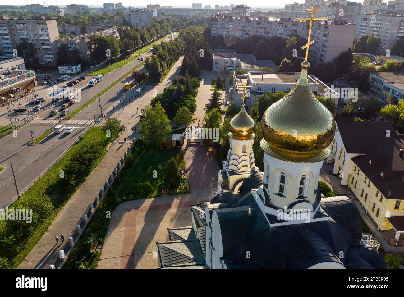 Drone view of an Orthodox church with gilded domes against the backdrop ...