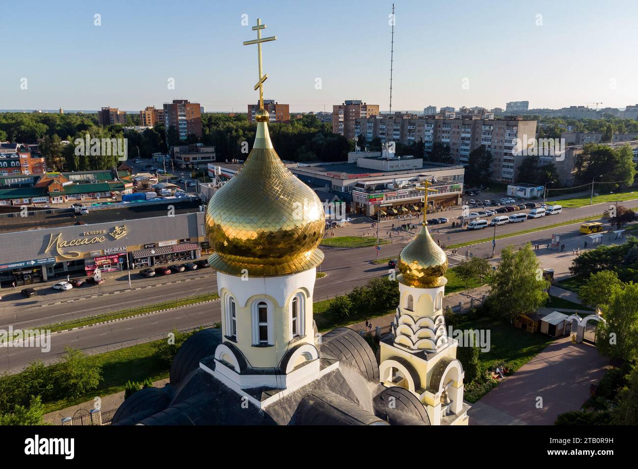 Drone view of an Orthodox church with gilded domes against the backdrop ...