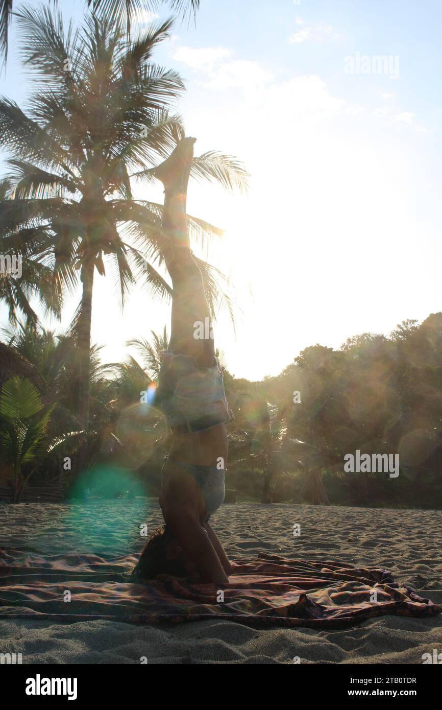 Woman headstand beach hi-res stock photography and images - Alamy