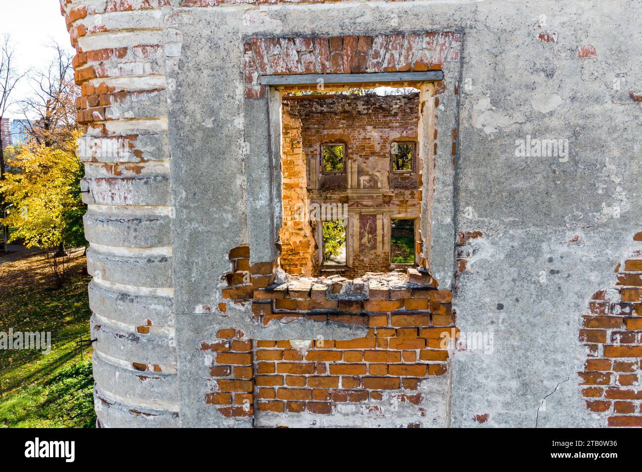 Exterior view through the second floor window of an old brick house ...