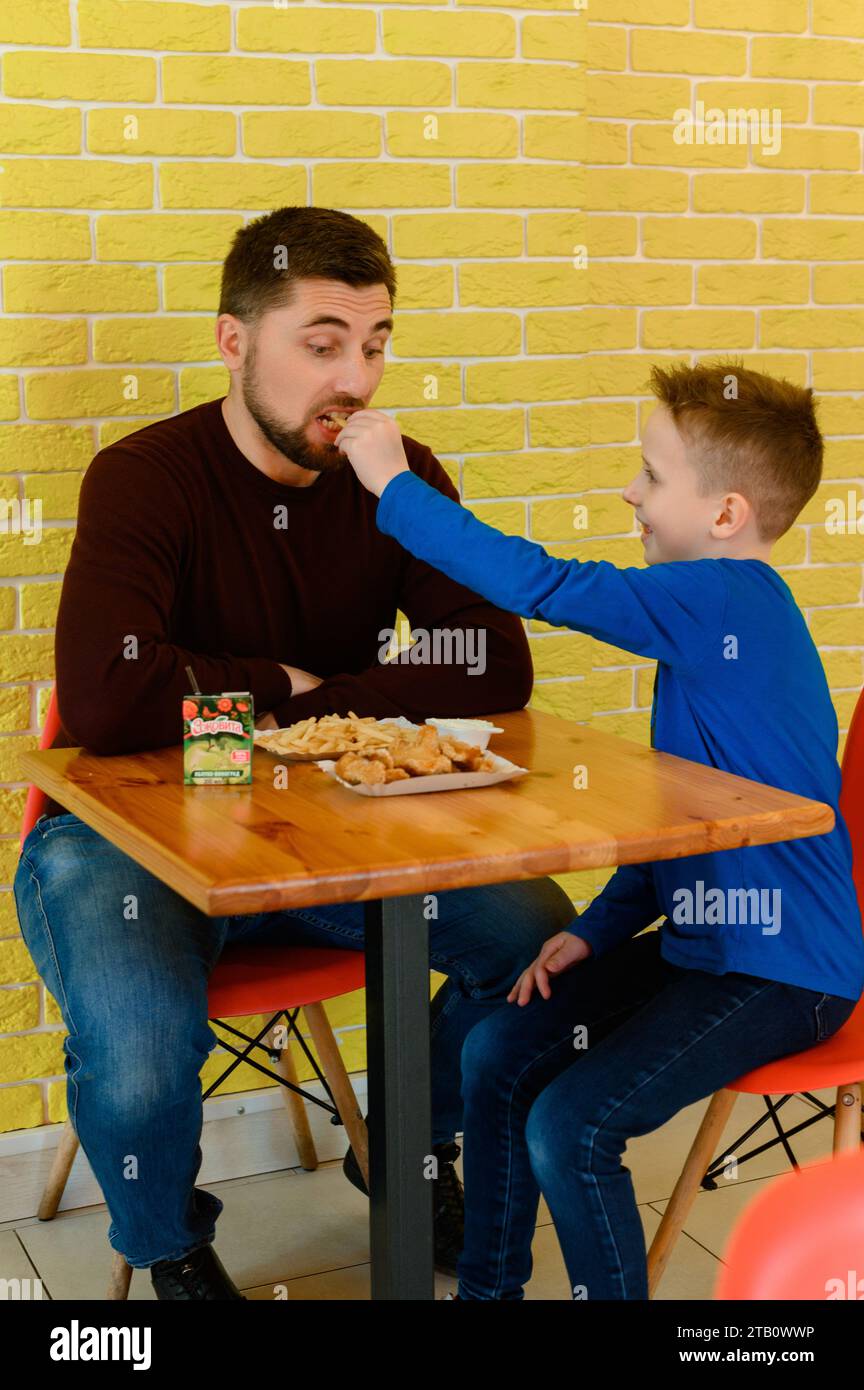 Children eat fries hi-res stock photography and images - Alamy