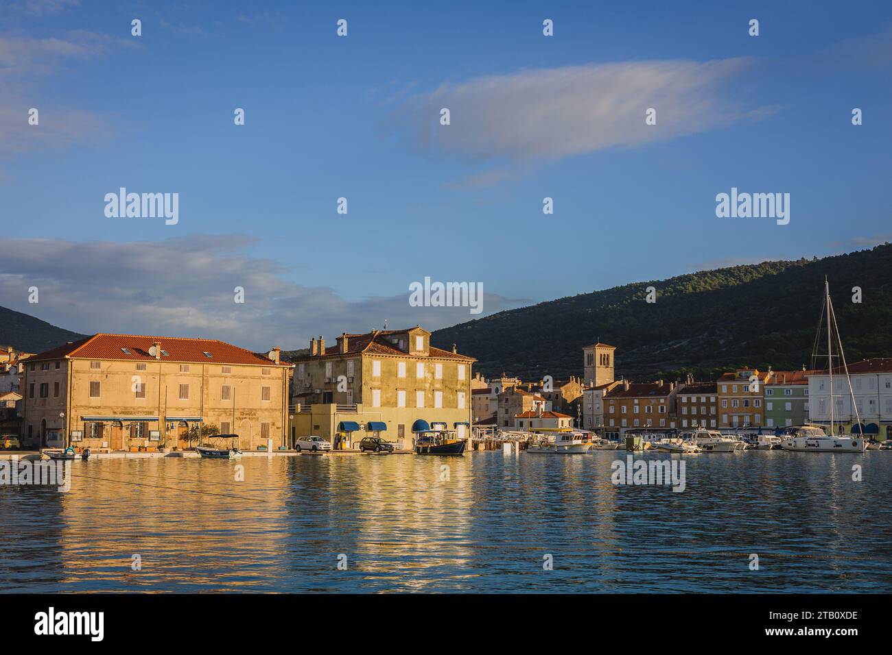 Central old part of the city of Cres viewed from the sea. Entry towards ...