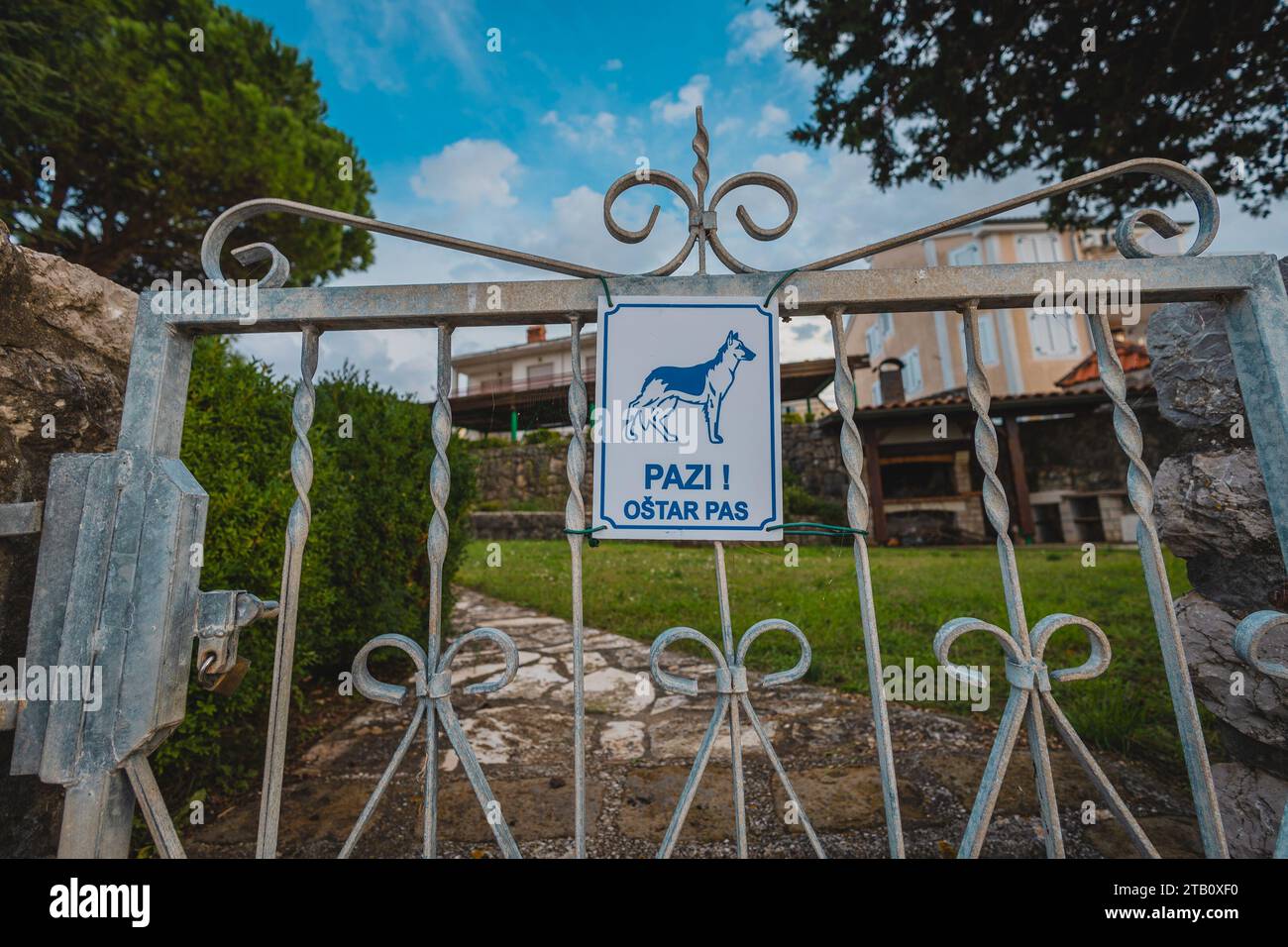 Sign reading "watch out, dangerous dog" written in croatian language ...