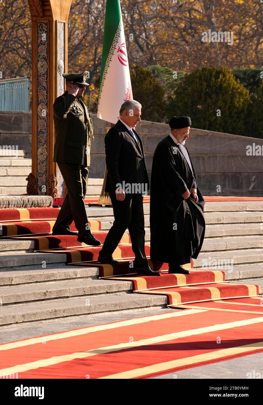 Cuban President Miguel Díaz-Canel, center, is welcomed by his Iranian ...