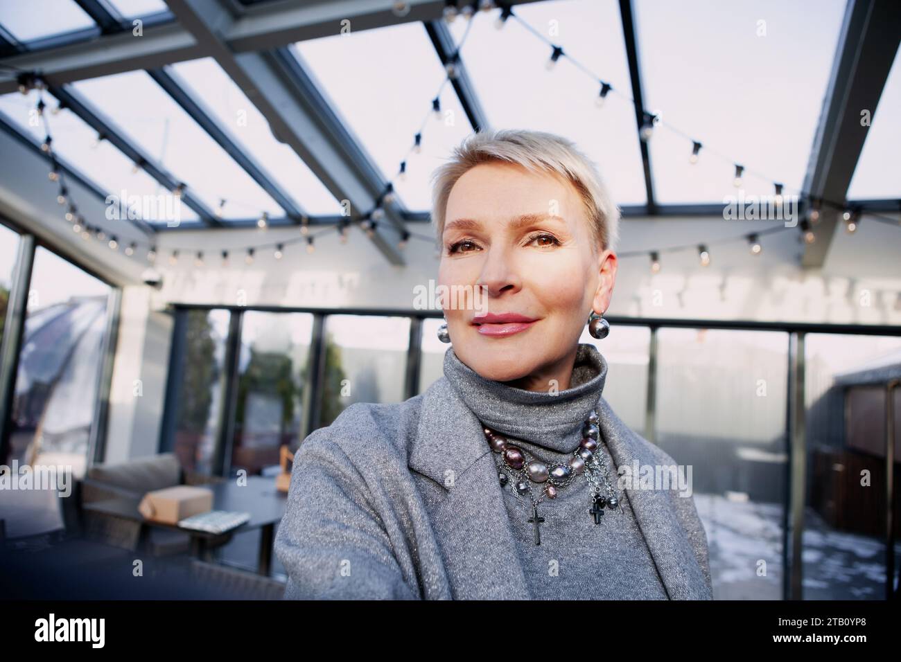 Close Up Selfie Of Fashionable Mature Woman With Chic Short Blonde Hair
