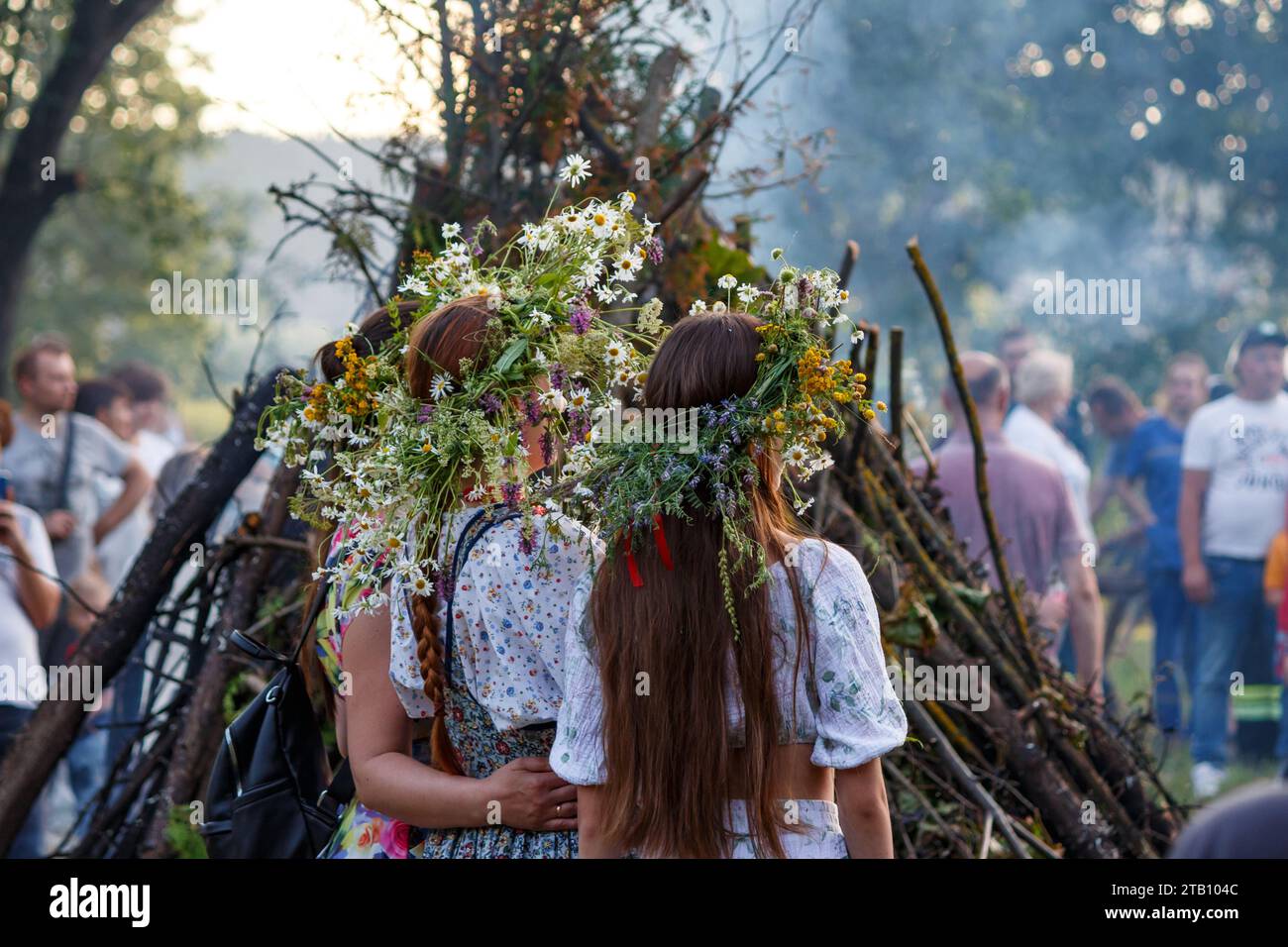 A wreath of wildflowers on the heads of girls during the summer Slavic ...