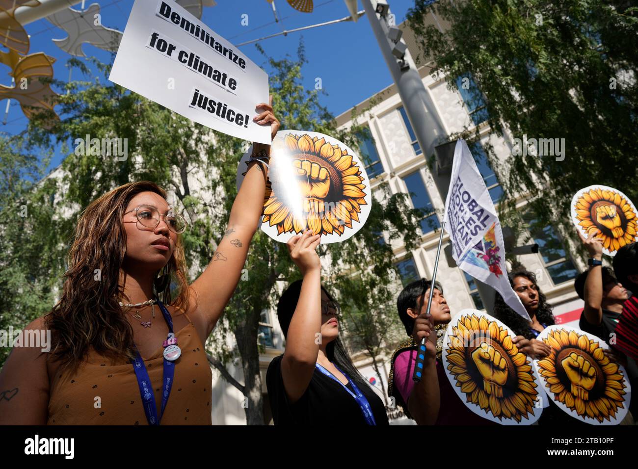 Mitzi Jonelle Tan, of the Philippines, holds a sign reading ...