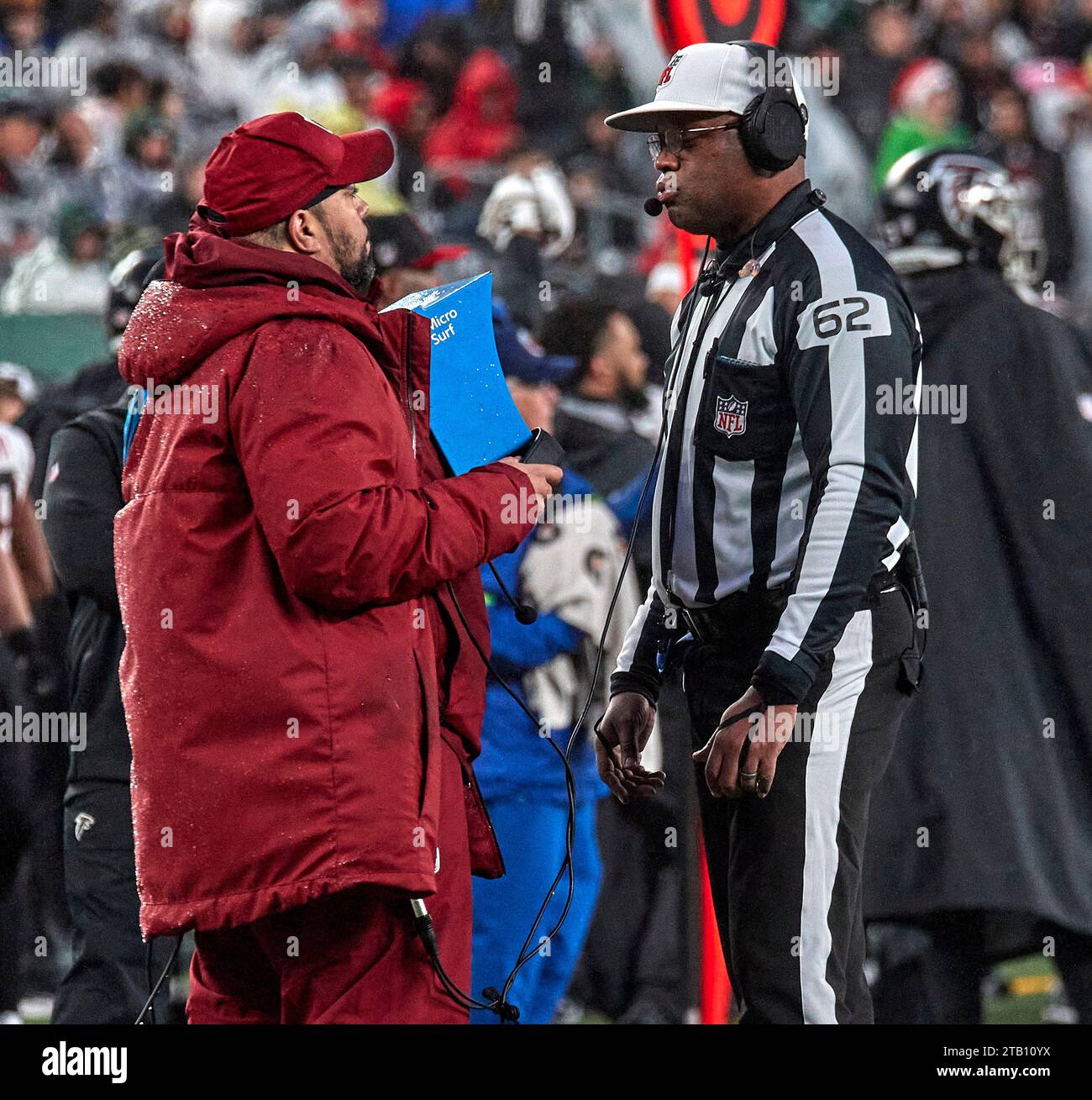 Referee Ronald Torbert (62) review and overturns a call during an NFL ...