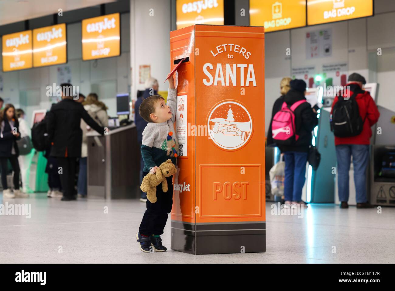 EDITORIAL USE ONLY Jacob Cox, aged 4, posts a letter to Santa via ...