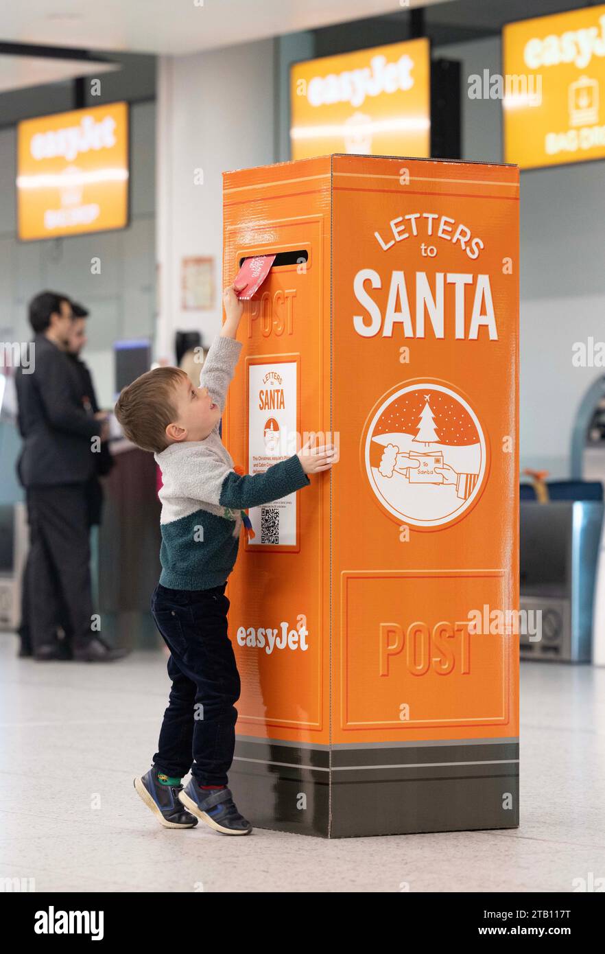 EDITORIAL USE ONLY Jacob Cox, aged 4, posts a letter to Santa via ...