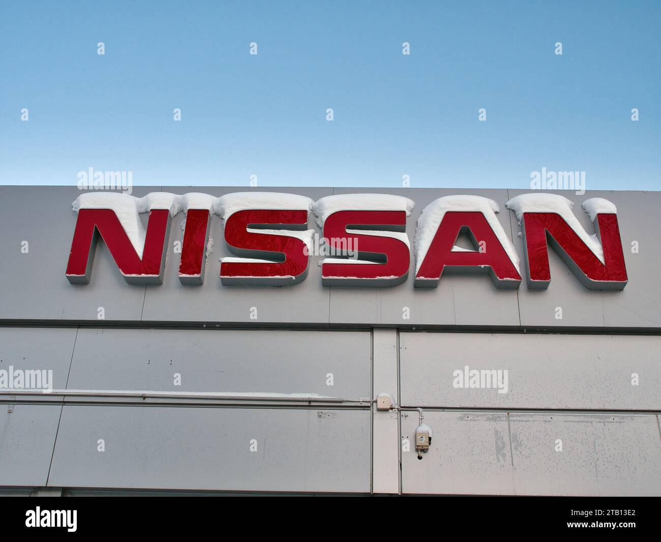 Nissan logo brand and text sign for dealership store in winter Stock ...