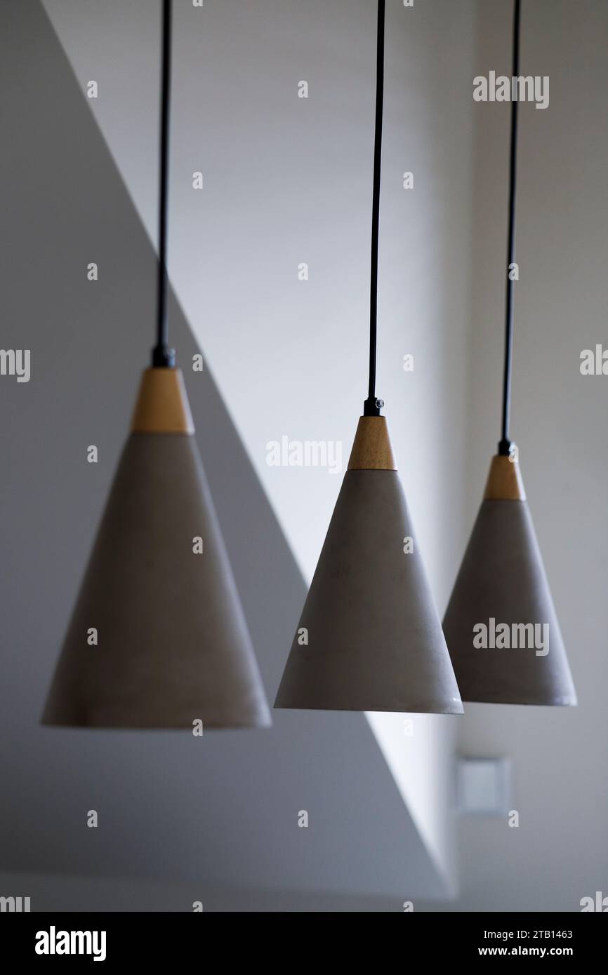 Cone shaped lights made of concrete. A set of three modern minimalistic ...