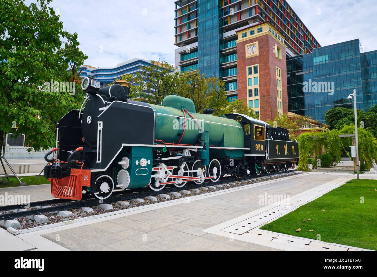 On display, a restored, black, old, steam locomotive train. At the ...