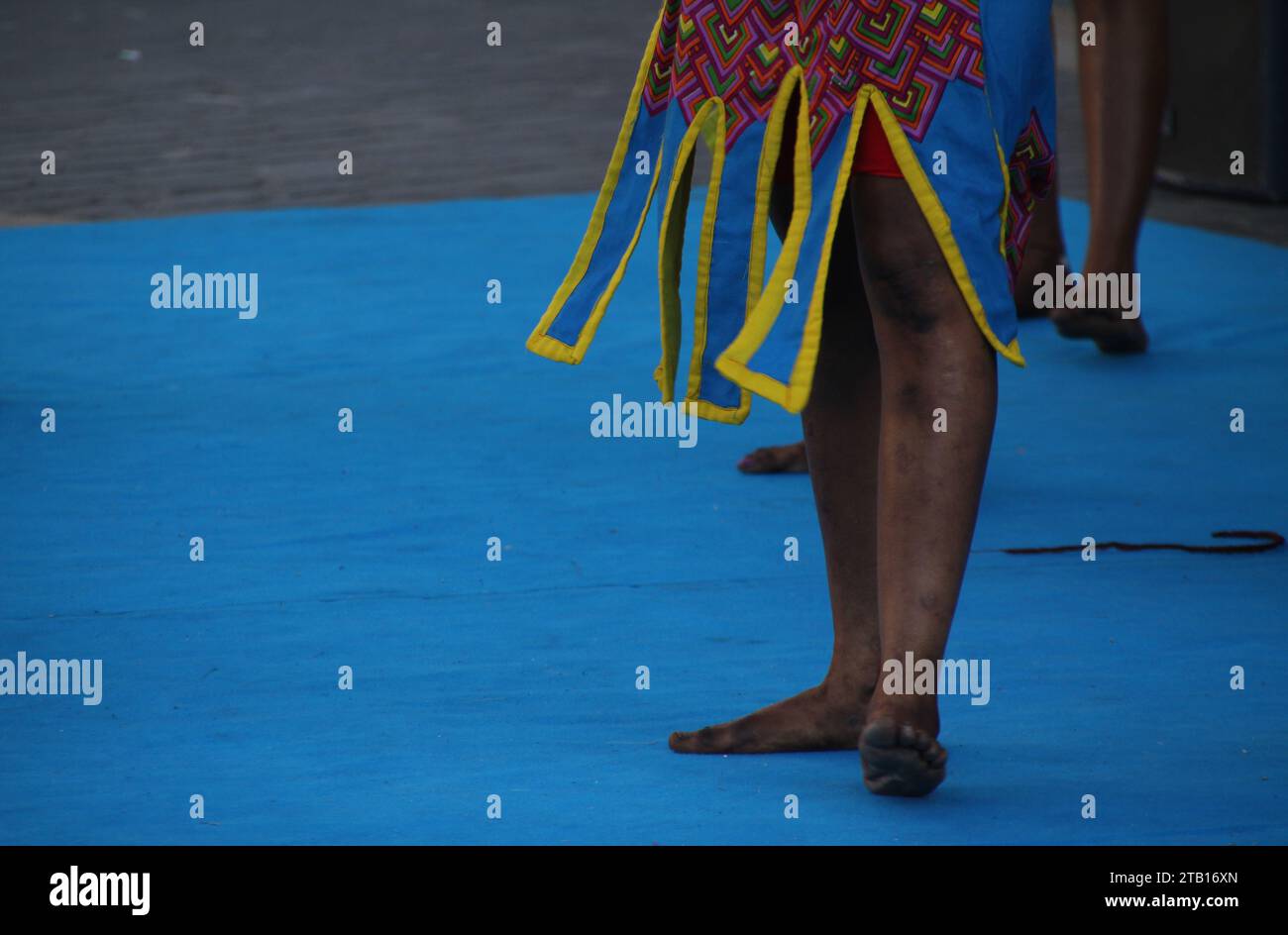 A group of excited African folk dancers, wearing traditional clothing ...