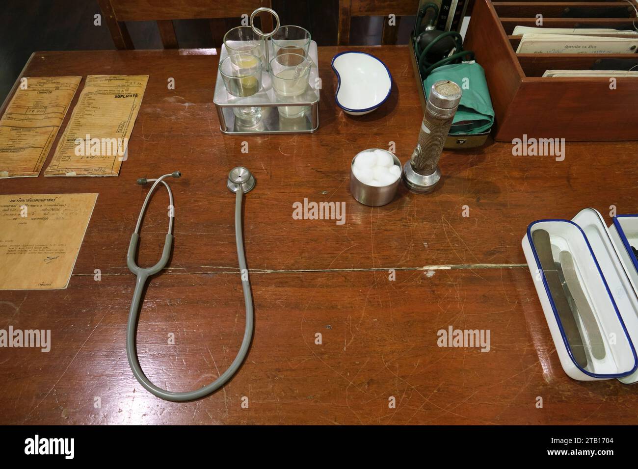 A recreation of an old doctor's office with various instruments on a ...