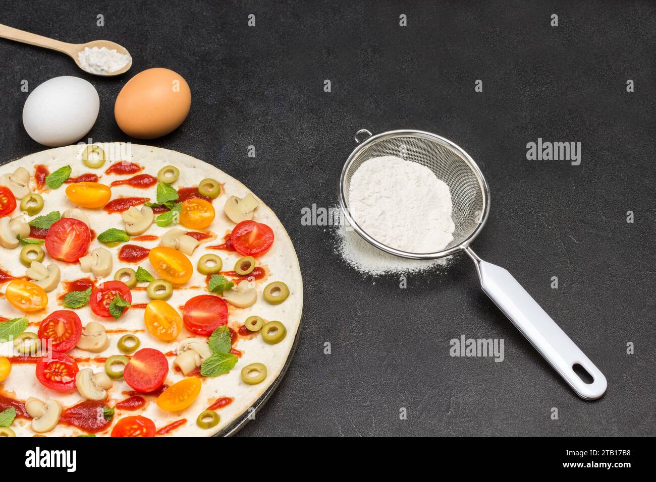 Round dough base for pizza. Food ingredients for cooking pizza. Flour ...