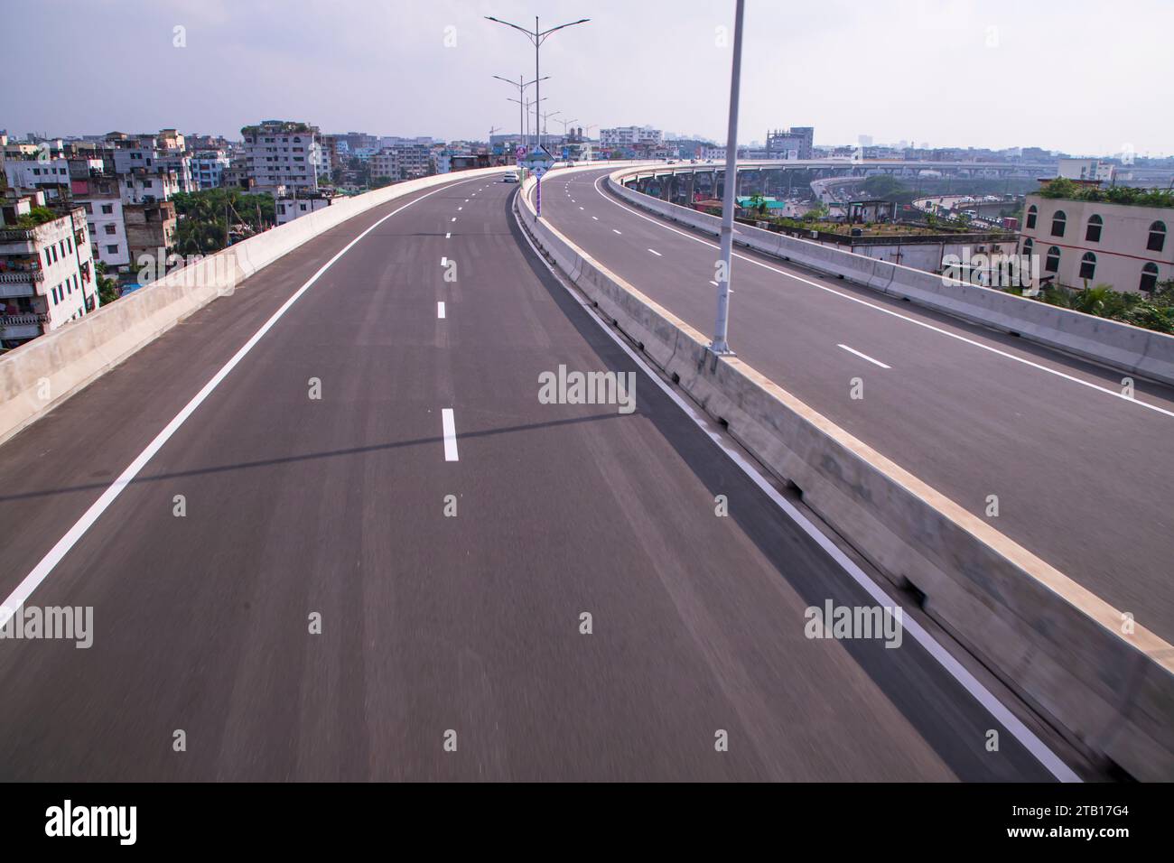 Non-stop speed way Dhaka Elevated Expressway with blue sky view Stock ...