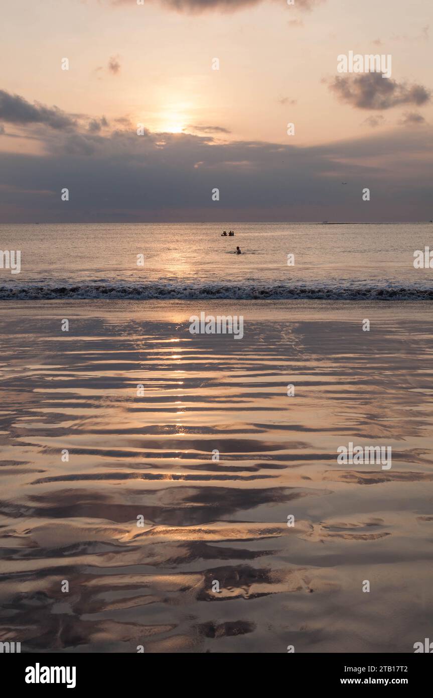 Sunset at Jimbaran Bay beach, Indonesia Stock Photo - Alamy