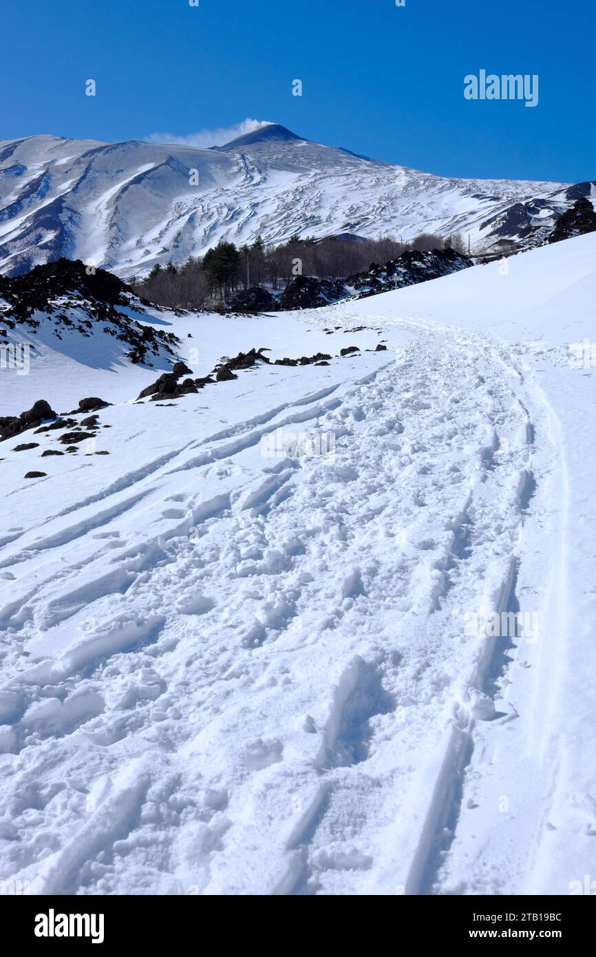 footprints on snowy and steep footpath to Mount Etna North-East Crater ...