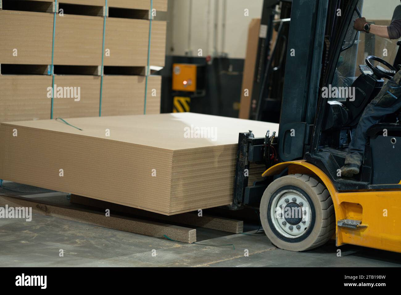 Close up of forklift working in warehouse. Industrial lift truck ...