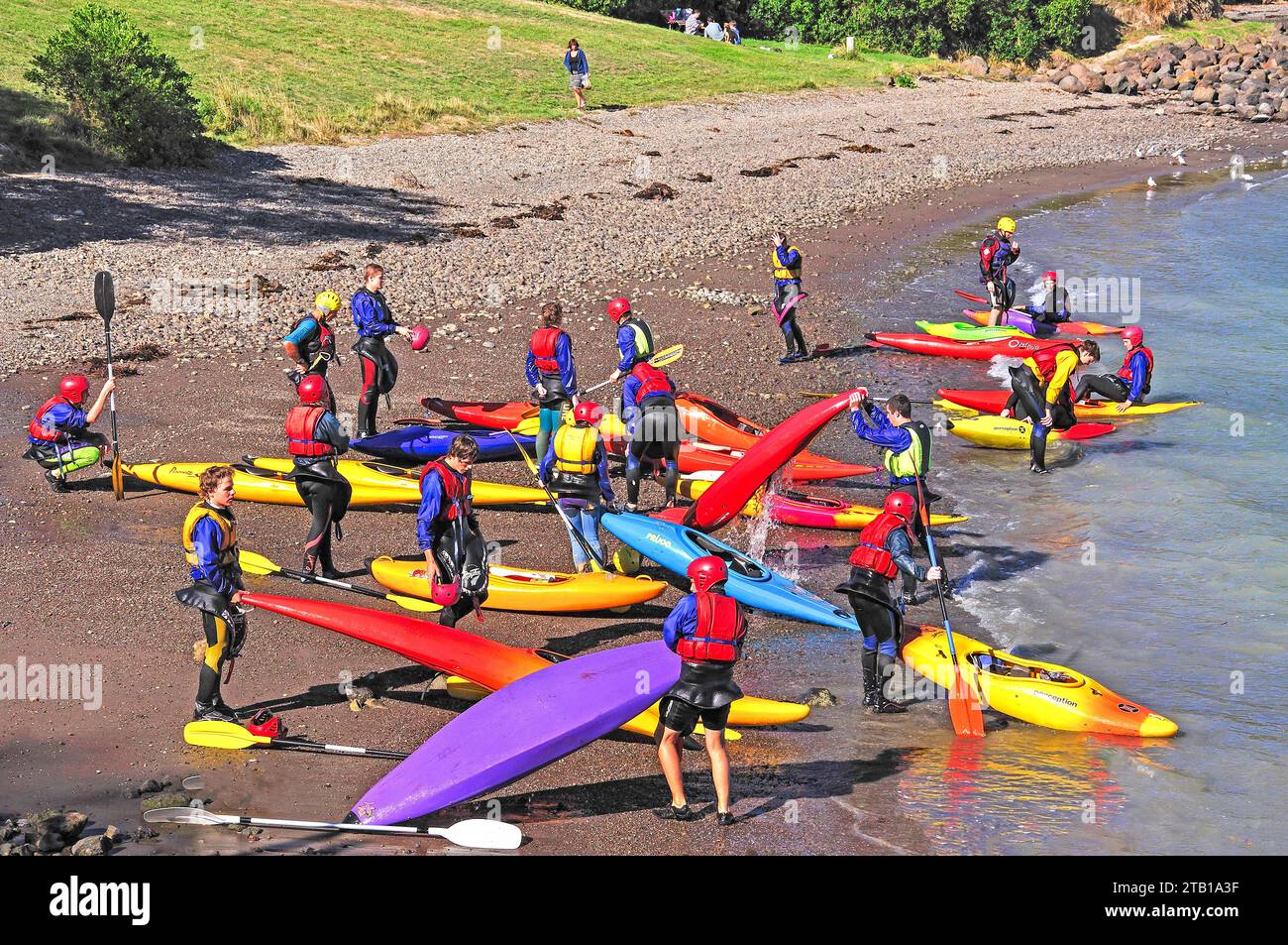 Teenage school group on kayaking course, Cass Bay, Lyttelton Harbour ...