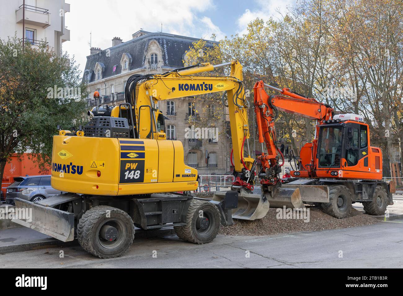 Nancy, France - Yellow and orange wheeled excavators Komatsu PW148-11 ...