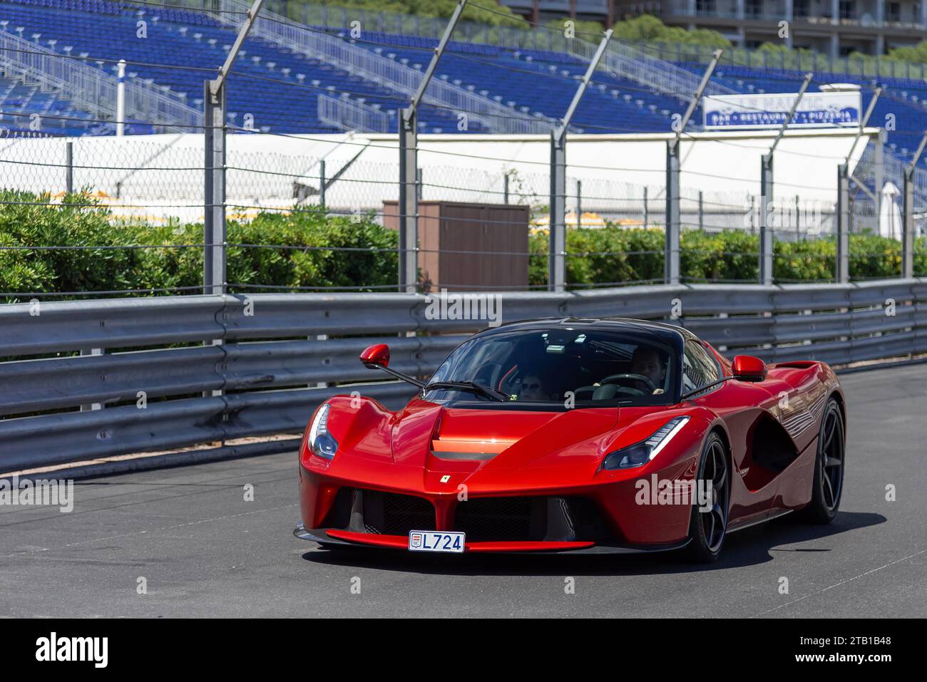 Monaco, Monaco - Rosso Fuoco Ferrari LaFerrari driving on the road ...