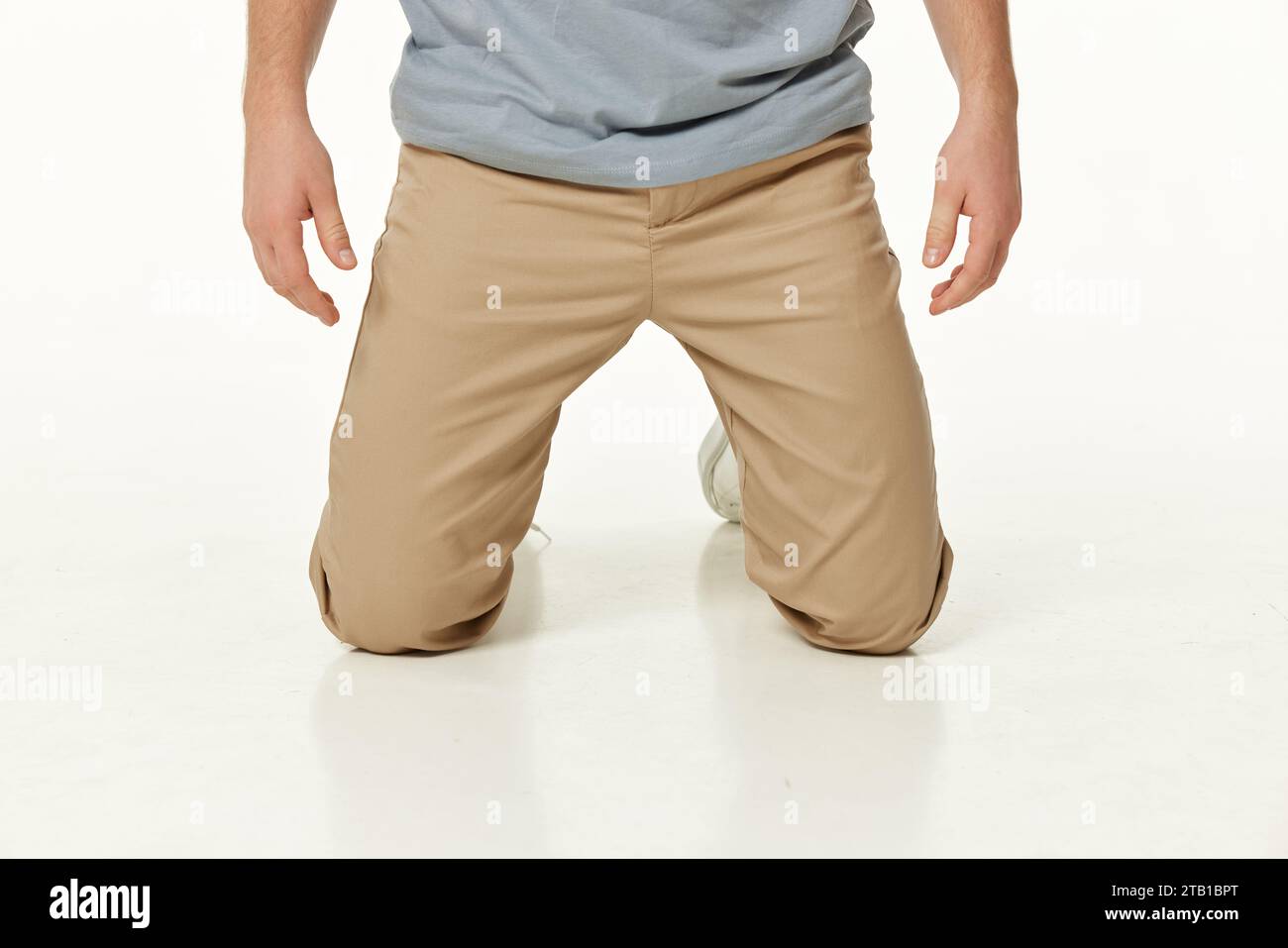 Man on knees beg hi-res stock photography and images - Alamy