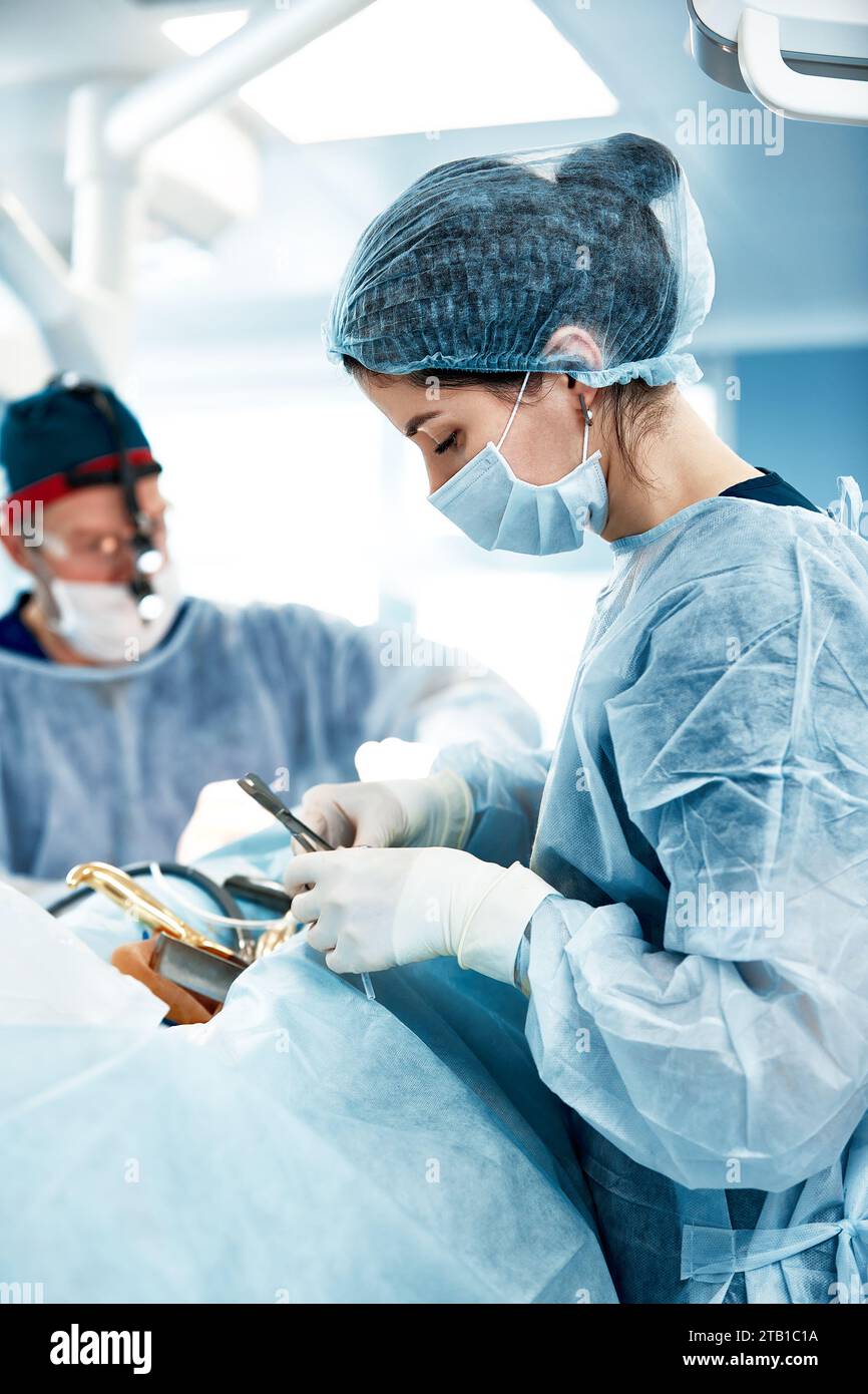 Close up of doctors and nurses in operating room, professional doctors ...